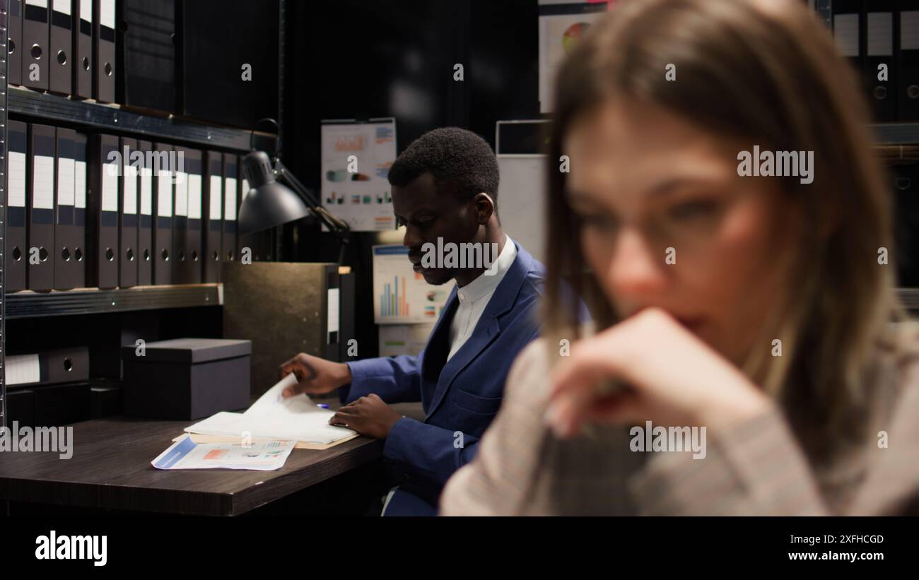 African american detective requests forensic report and suspect ...