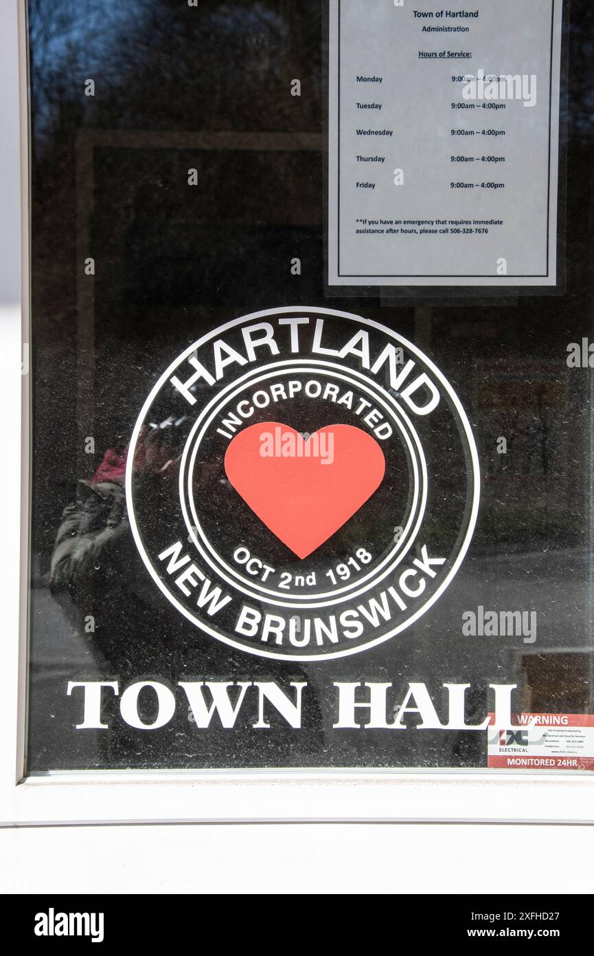 Town hall sign in the window with hours of operation on Orser Street in ...