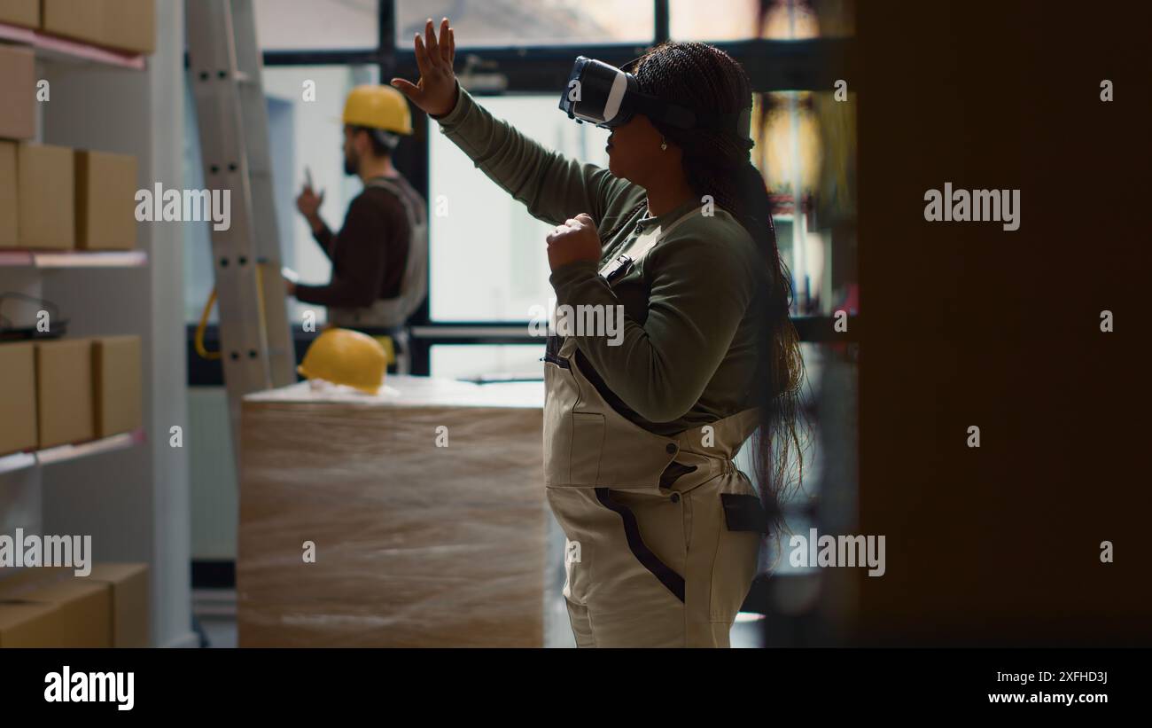 Head of logistics in warehouse wearing VR goggles, using technology to ...