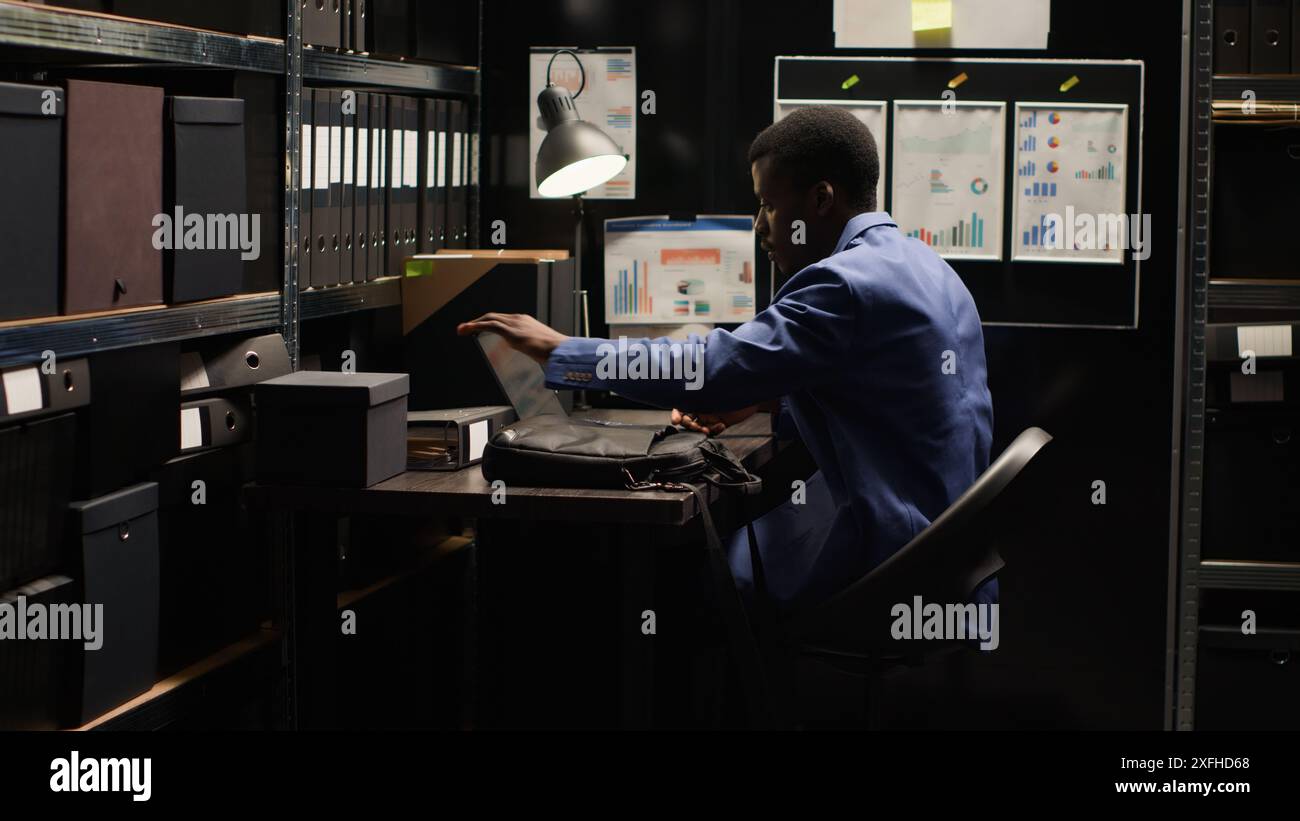 African American detective inspector arrives at office, investigating ...