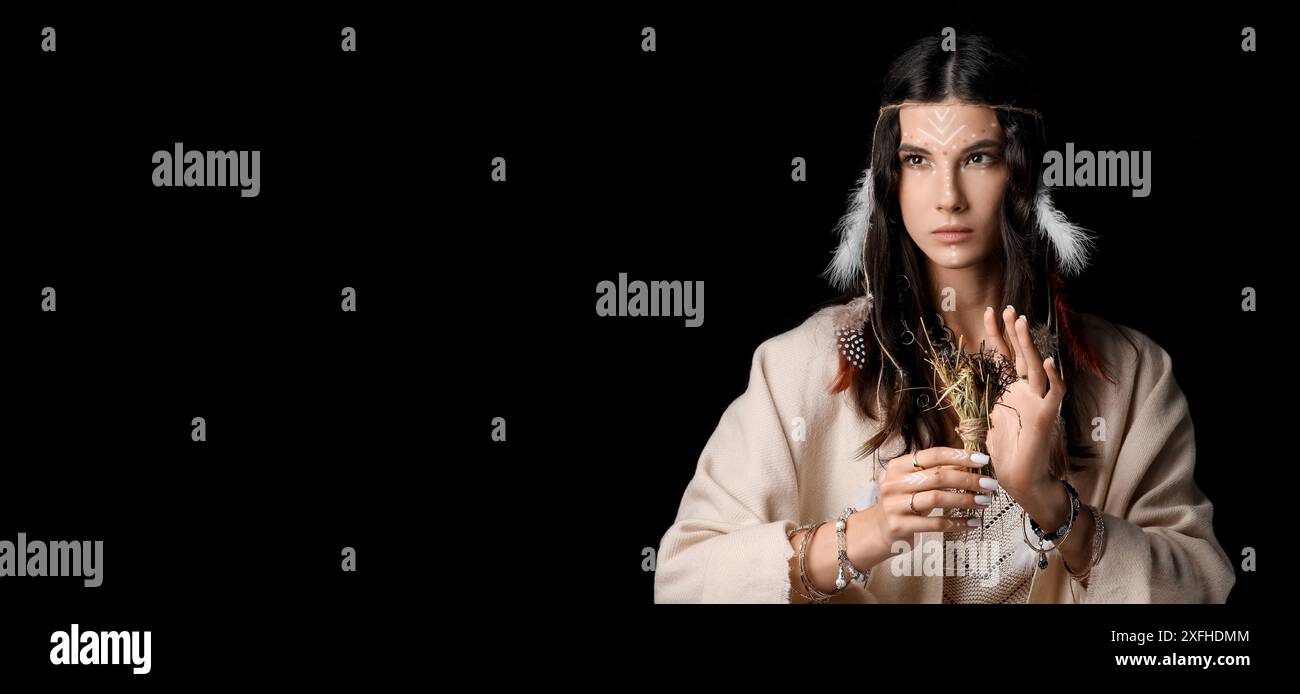 Beautiful female shaman with herbs on dark background with space for ...