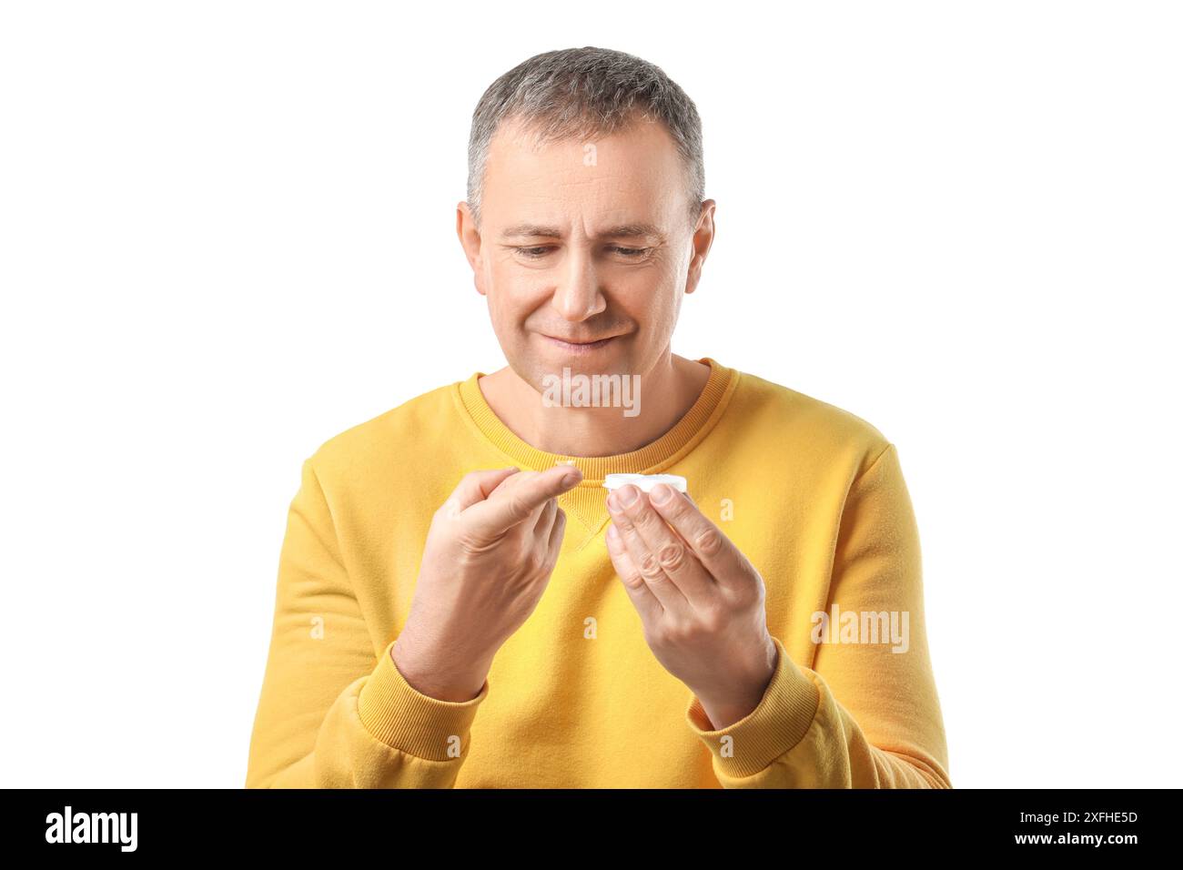 Mature man with contact lens and case on white background Stock Photo ...