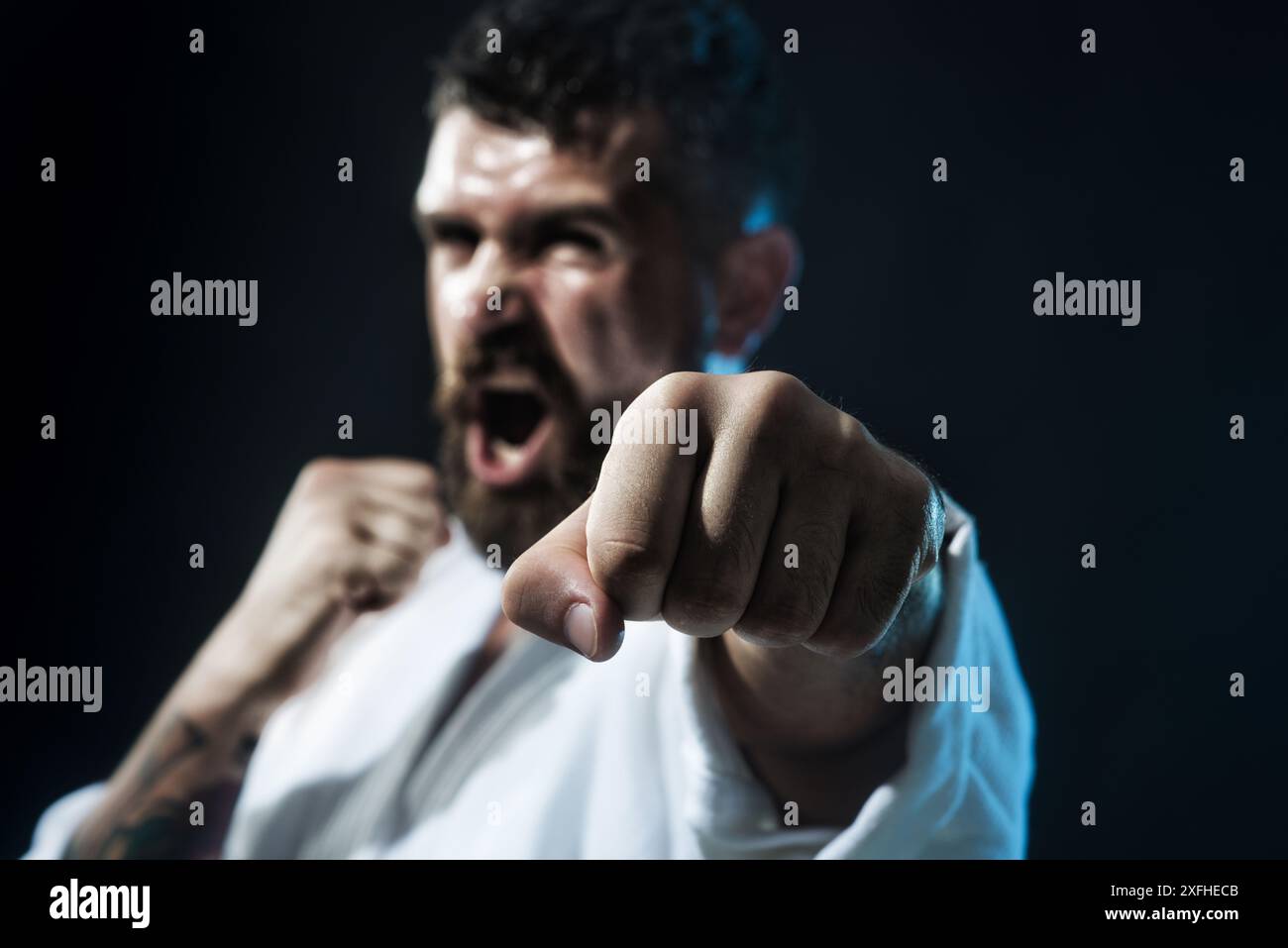 Karate man in fighting position. Mixed martial arts fighter training at ...