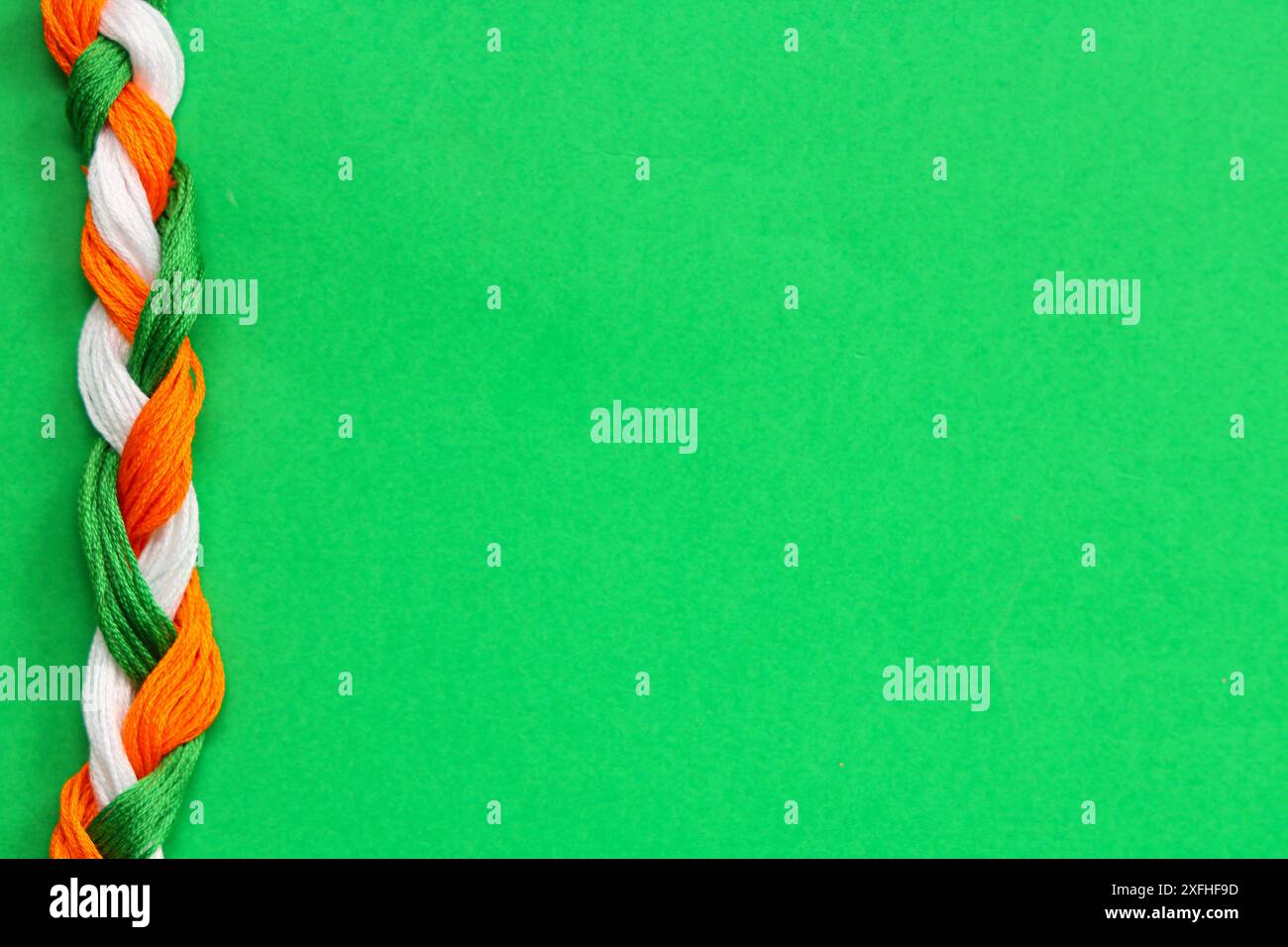 Braided embroidery threads in colors of Indian flag on green background ...