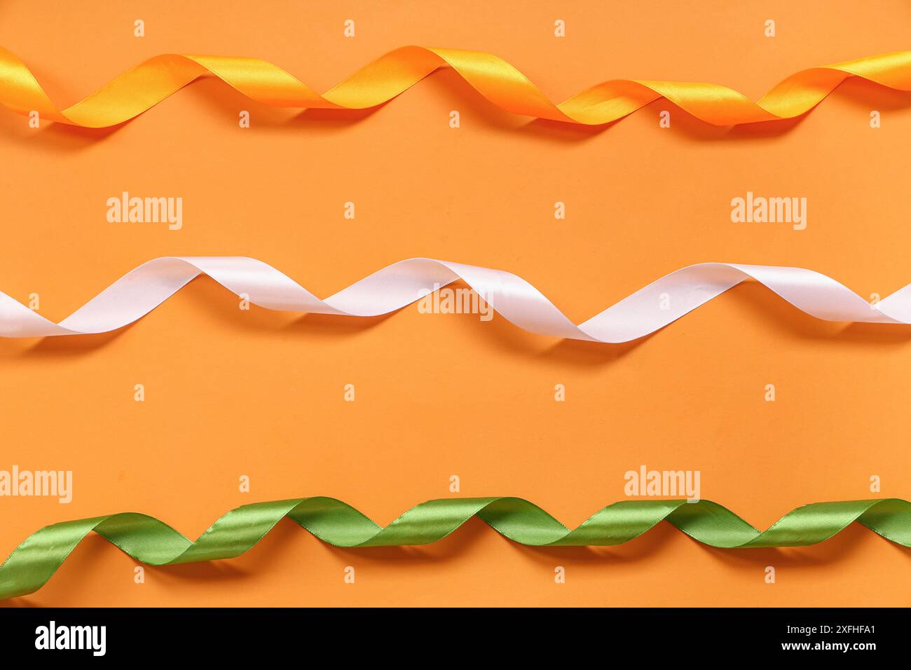 Satin ribbons in colors of Indian flag on orange background. Indian ...