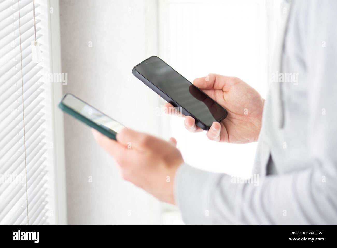 Using their mobile phones hi-res stock photography and images - Alamy