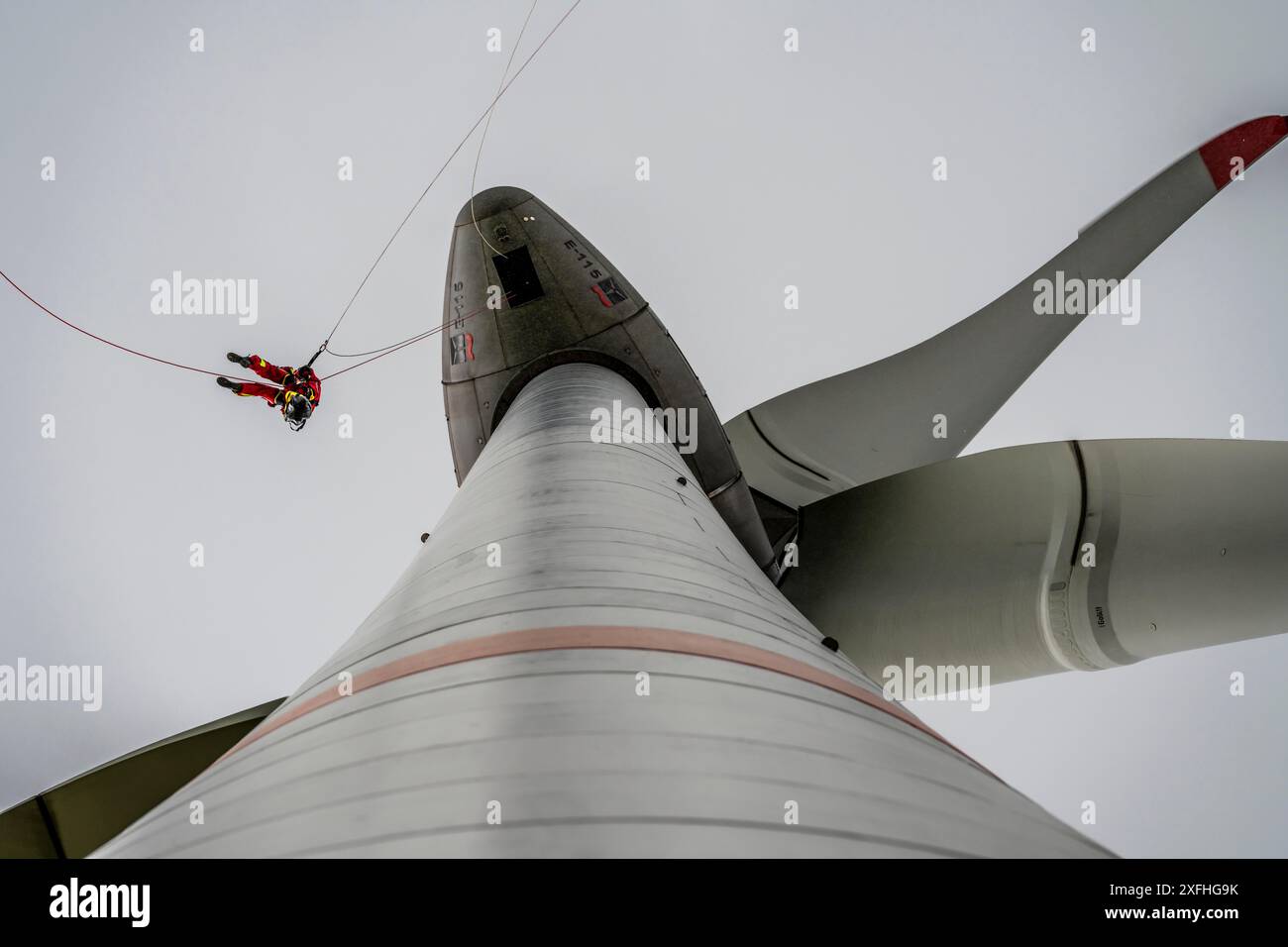 Height rescuers from the Oberhausen fire department practise abseiling ...