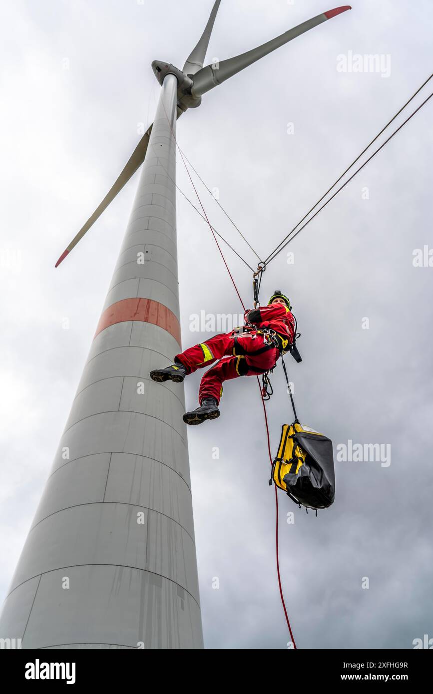 Height rescuers from the Oberhausen fire department practise abseiling ...