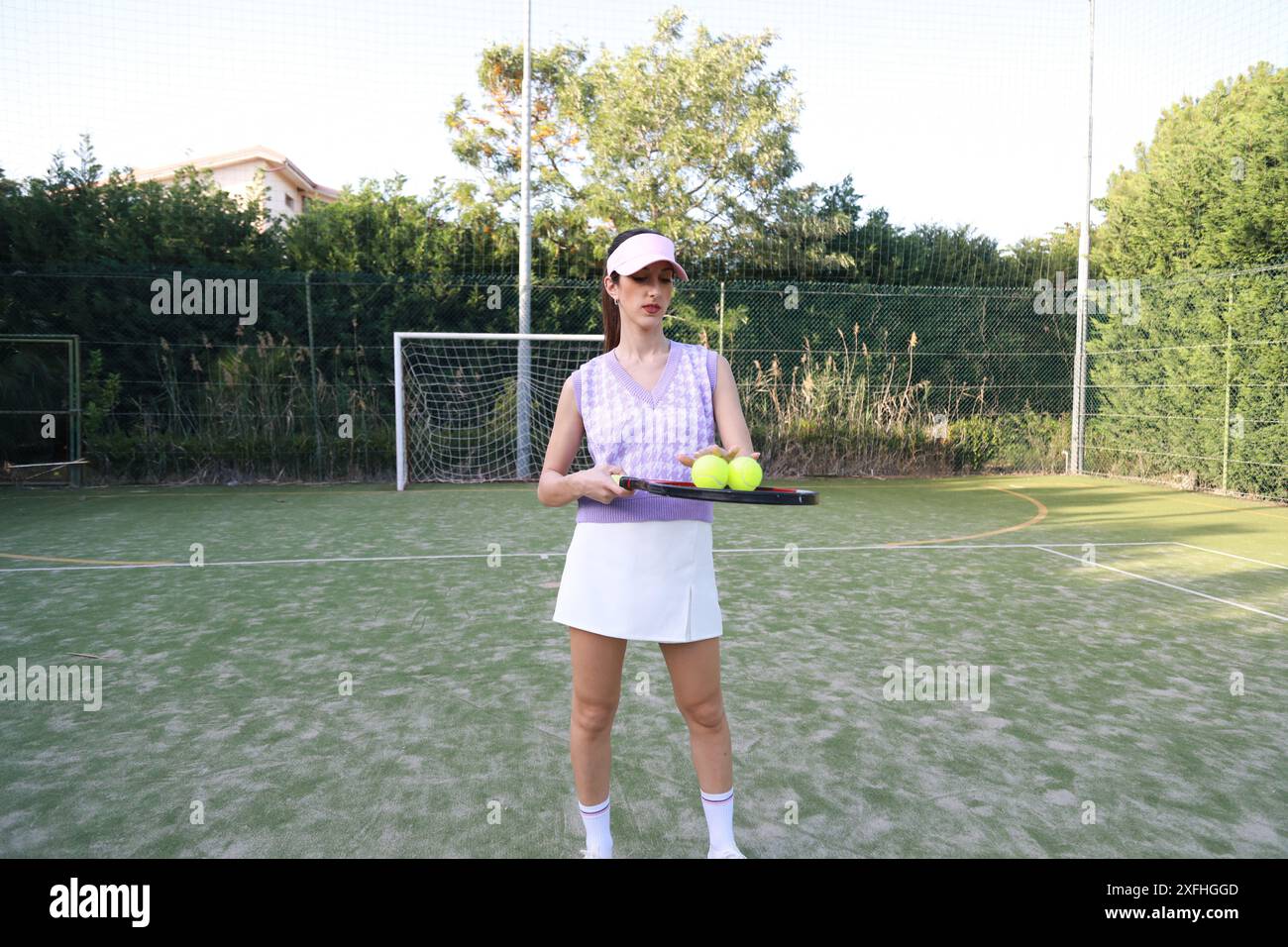 Woman Keeping The Balls In Balance On Her Racket Stock Photo - Alamy