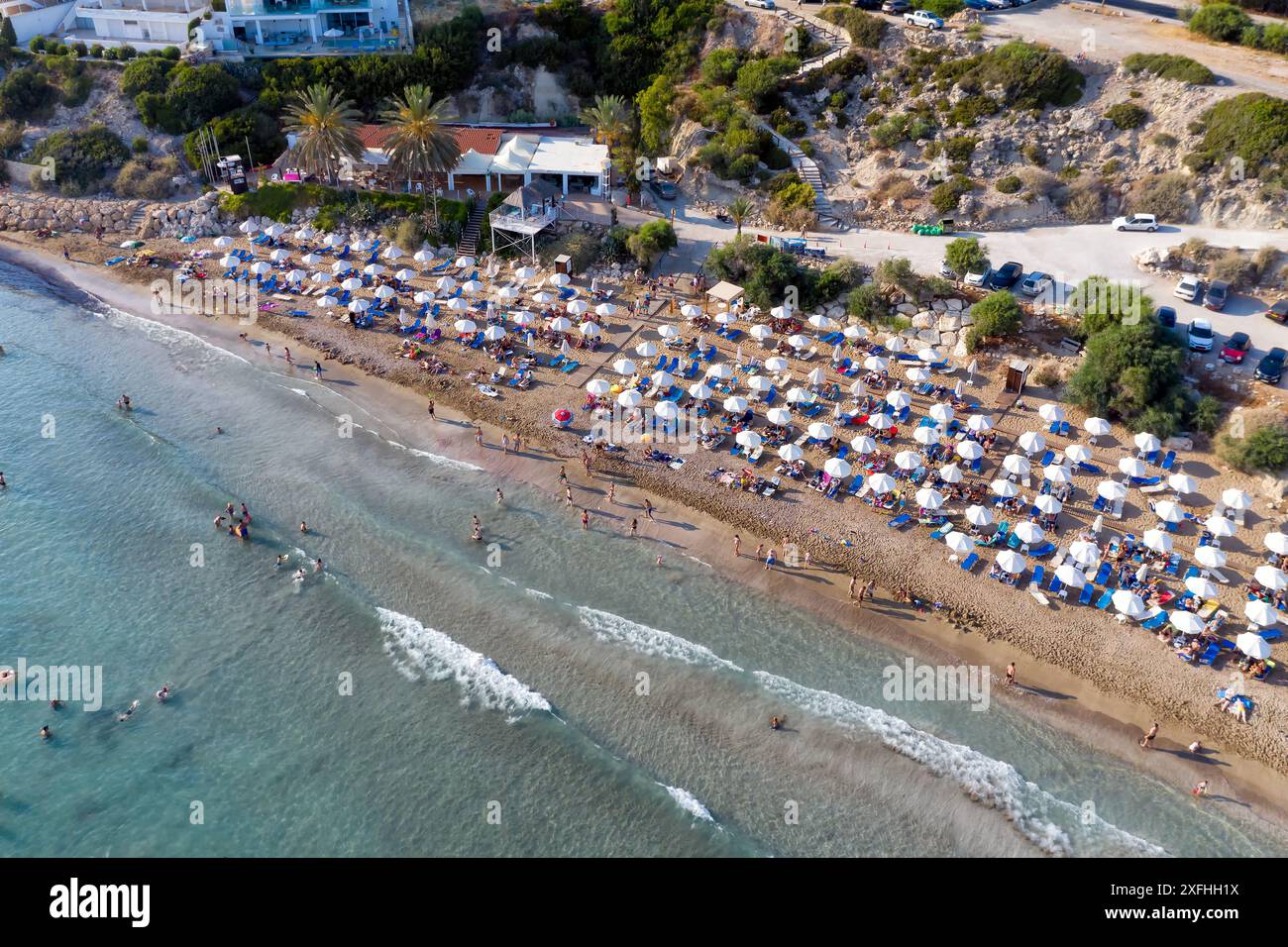 Aerial view of people enjoying summer vacation on the beach. Paphos ...