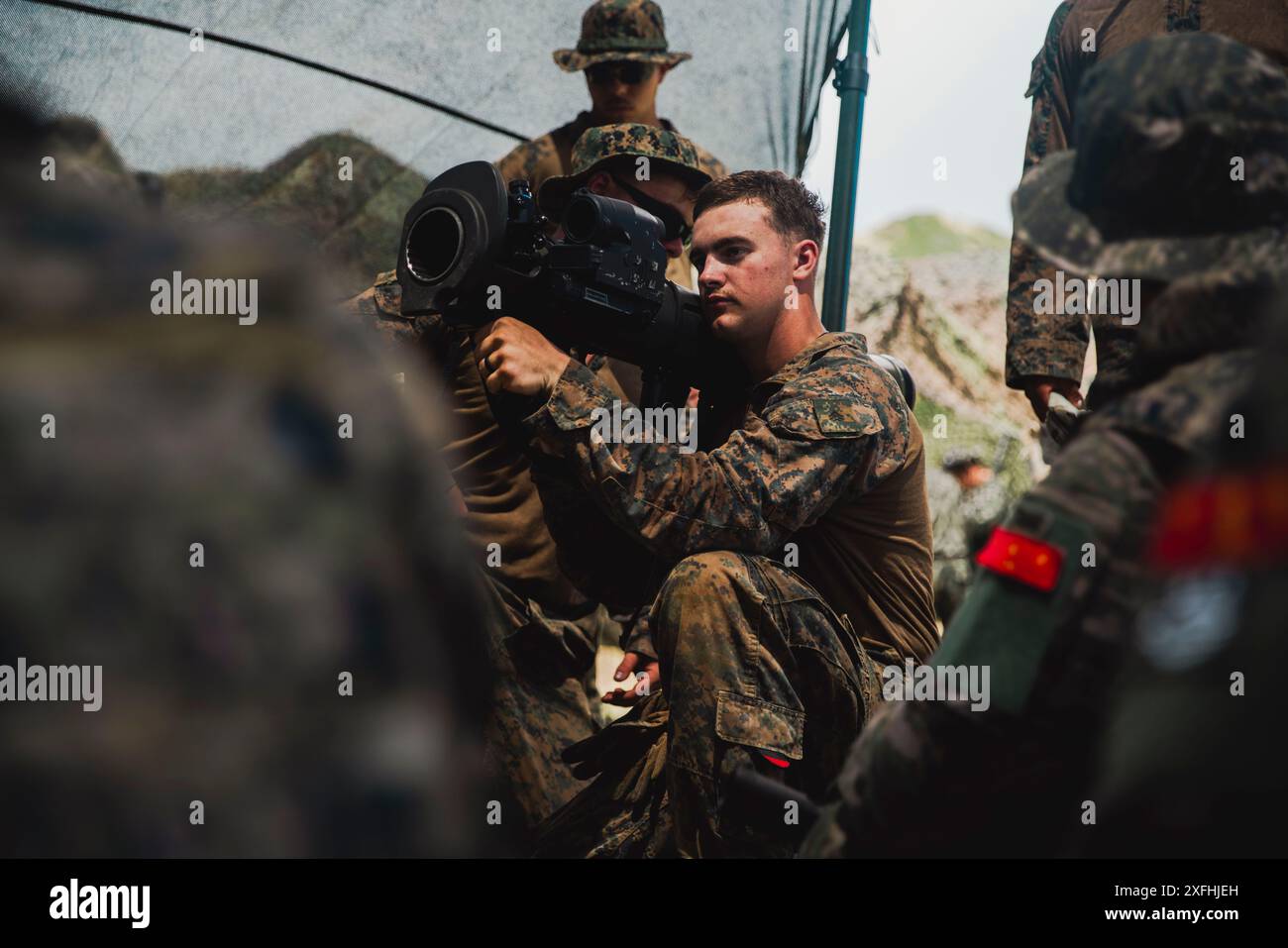 U.S. Marine Corps Cpl. Joshua Long, center, a rocketeer assigned to ...