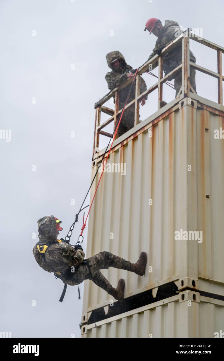 Airmen and Soldiers from the Oregon National Guard rappel off a storage ...