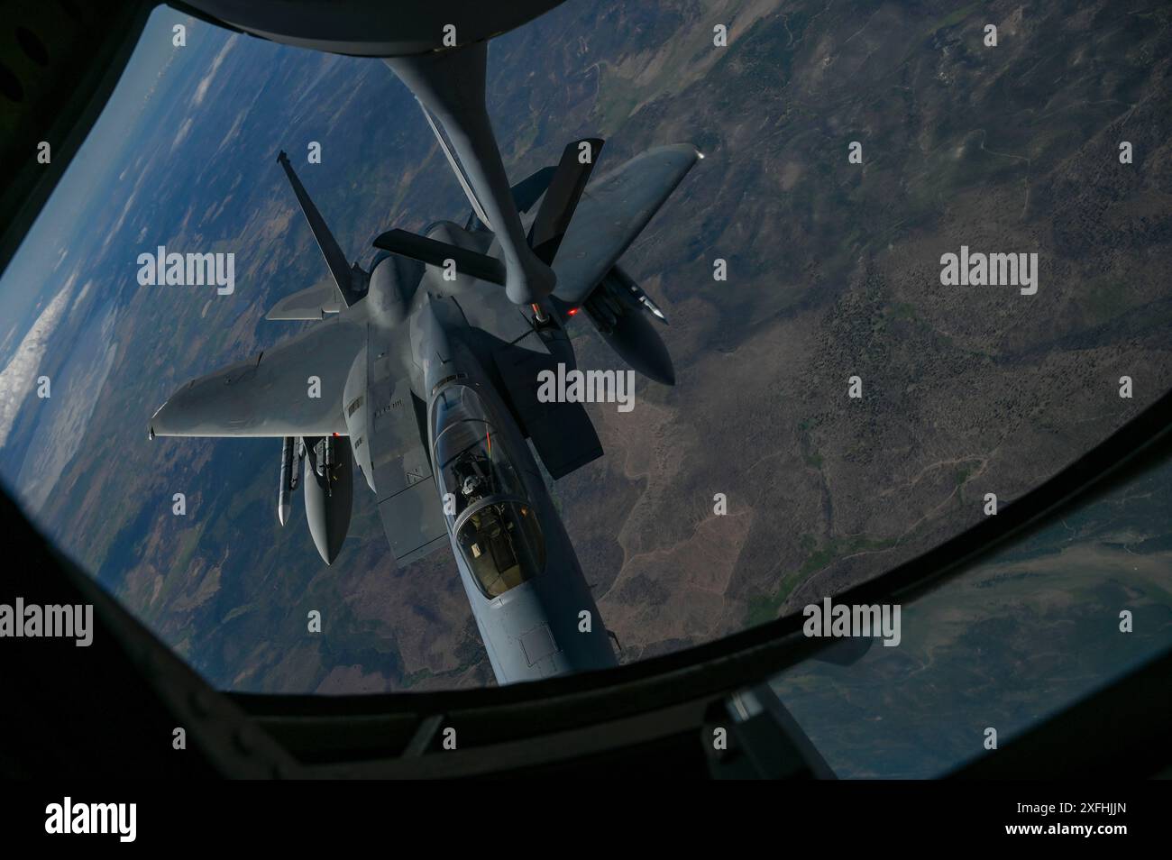 An F-15C Eagle assigned to the 142nd Fighter Wing receives fuel from a ...