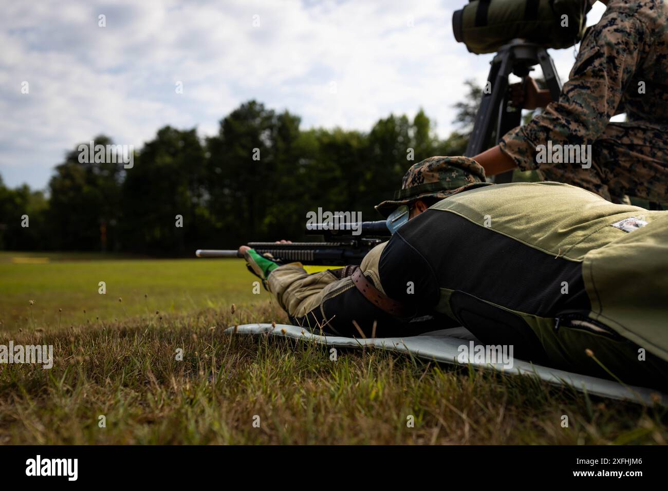 A U.S. Marine with the United States Marine Corps Shooting Team takes ...