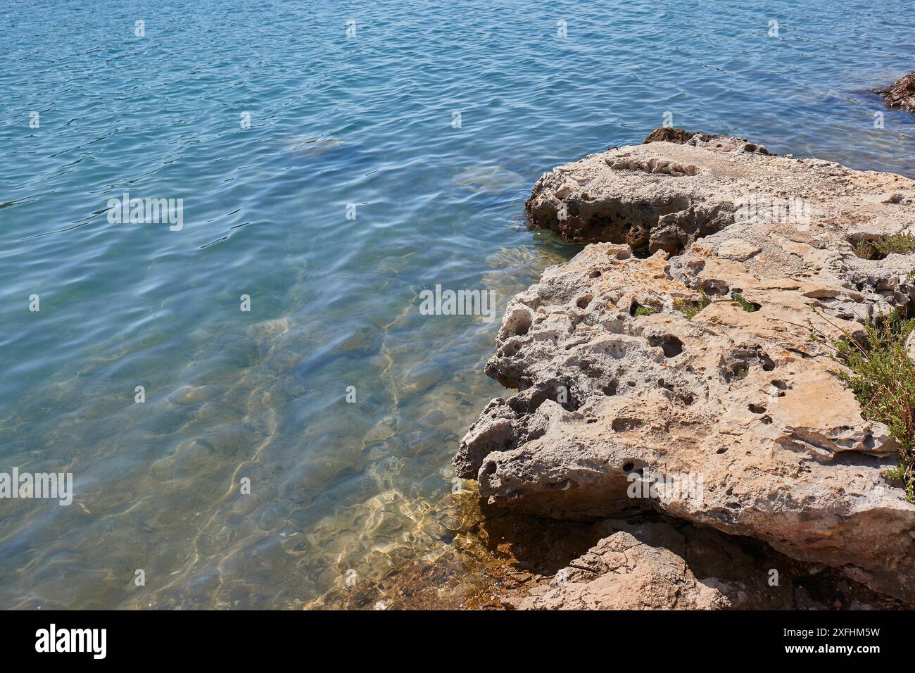 Calm water surface rocky shore hi-res stock photography and images - Alamy