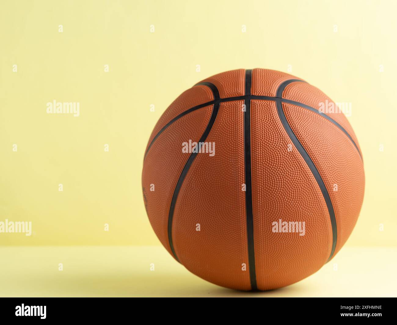 Basketball yellow background Isolated Stock Photo - Alamy