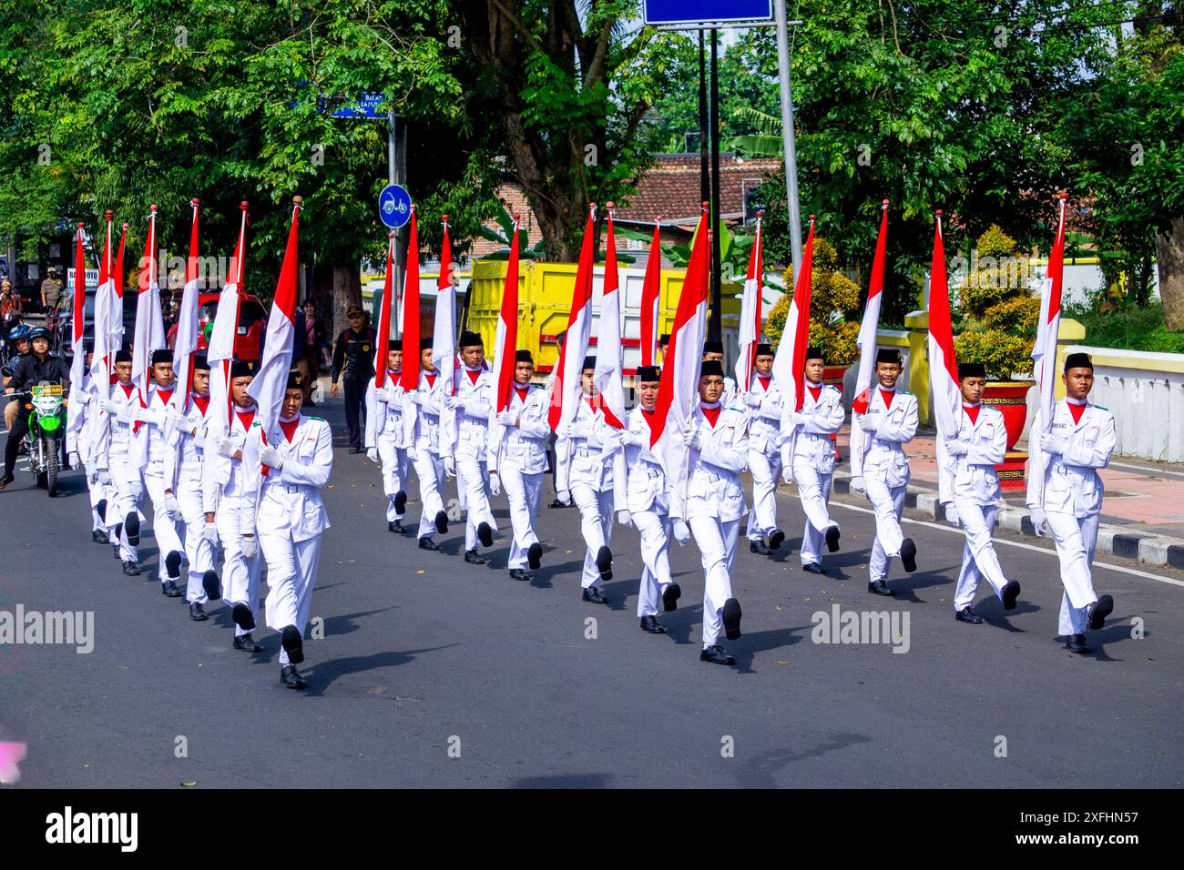 The flag-raising troops were carrying red and white flags. Those who ...