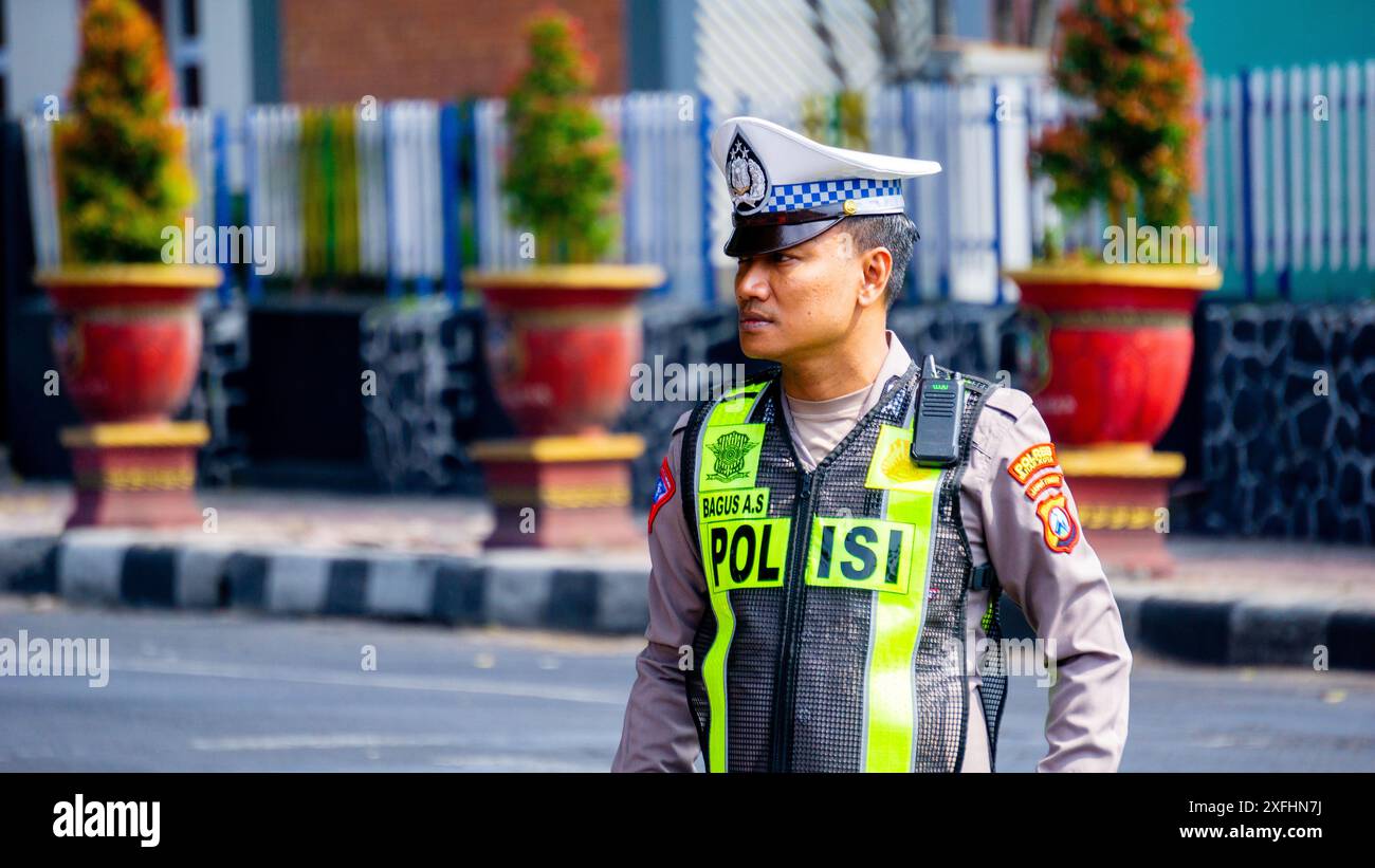 Indonesian police are controlling traffic on the road Stock Photo - Alamy