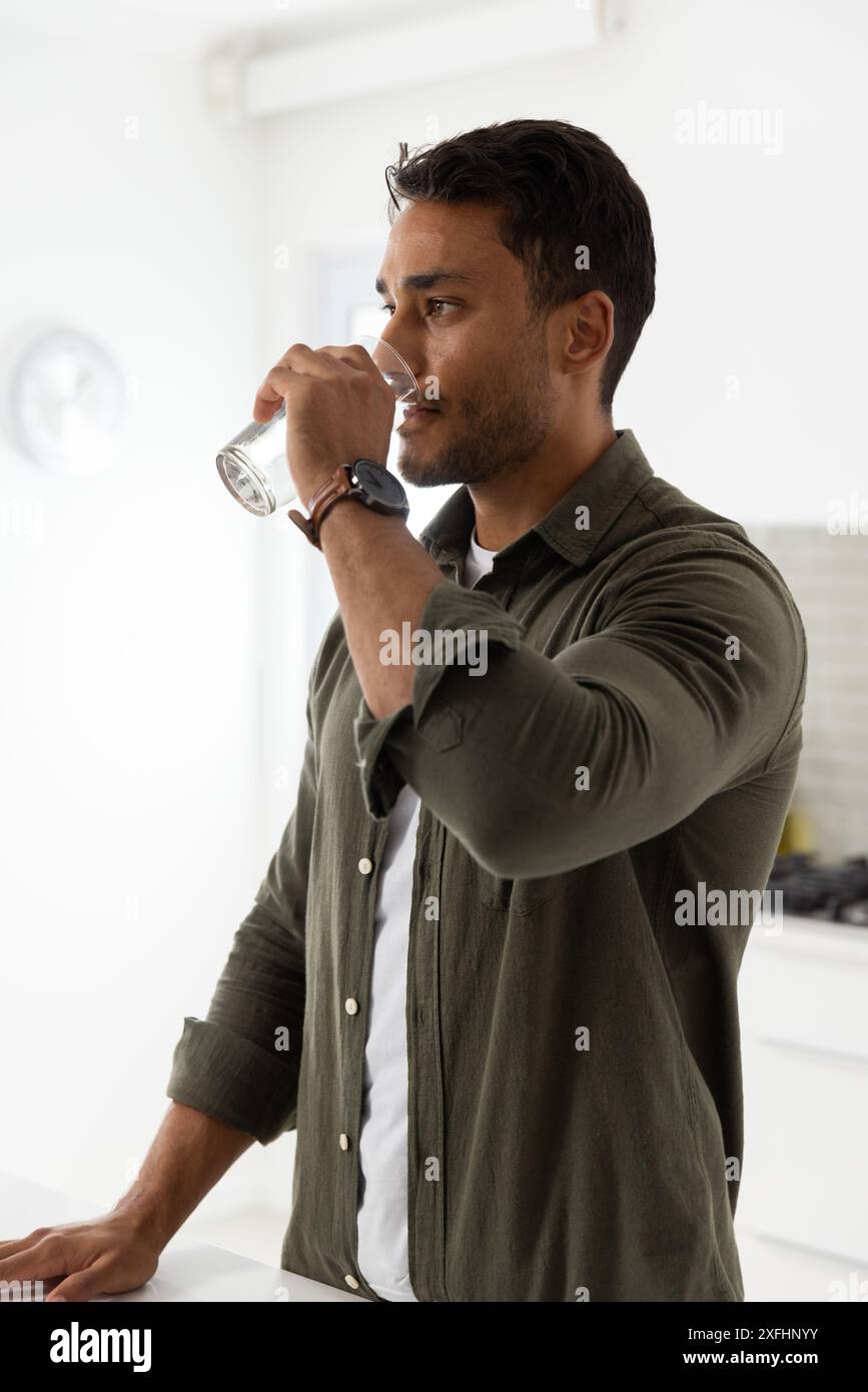 Drinking water man kitchen hi-res stock photography and images - Alamy
