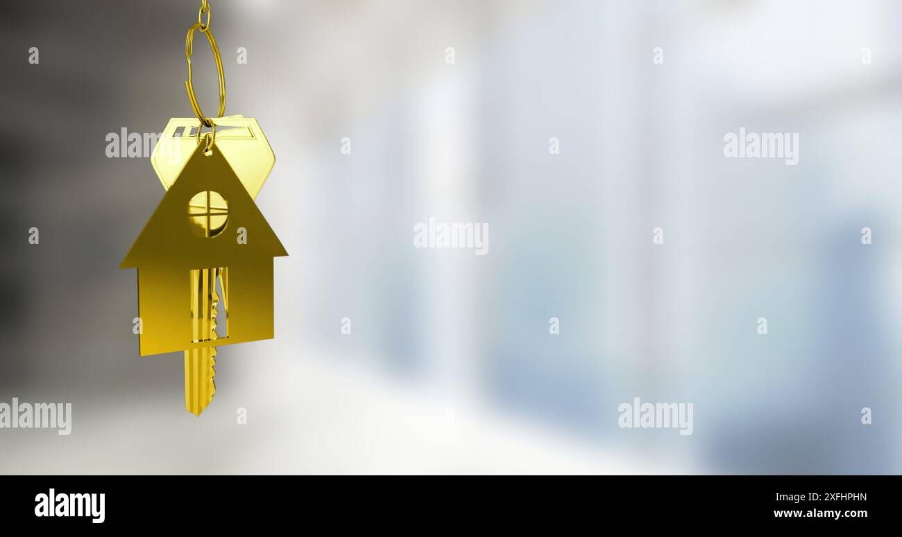 Image of gold key with house key fob and copy space over out of focus ...