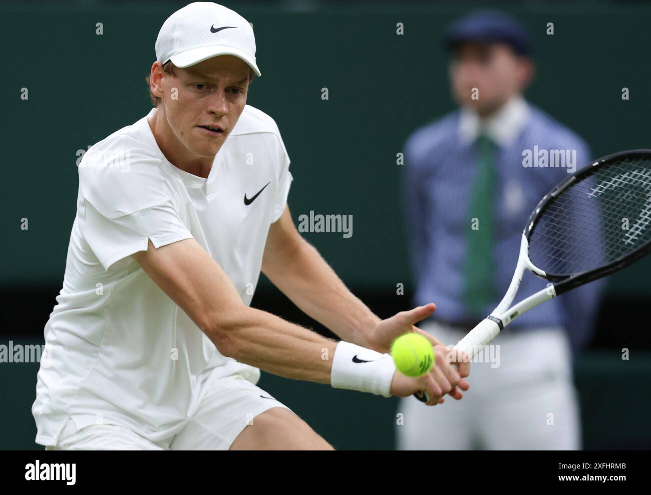 London, Britain. 3rd July, 2024. Jannik Sinner of Italy hits a return during the men's singles ...