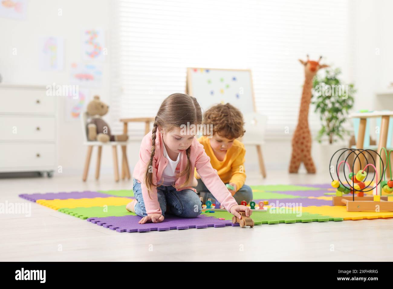 Children playing on mat hi-res stock photography and images - Alamy