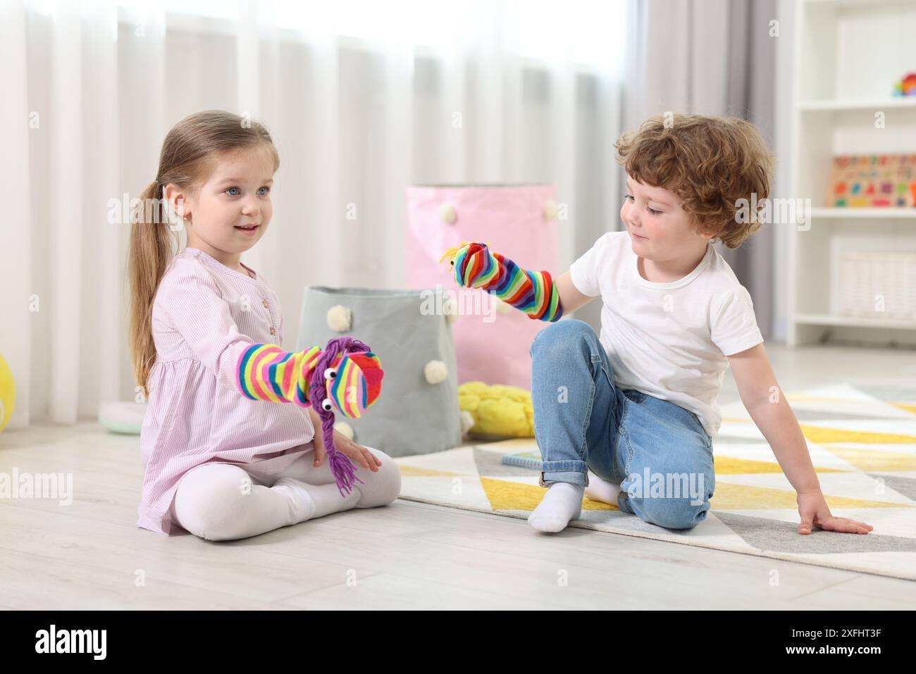 Children playing with puppets hi-res stock photography and images - Alamy