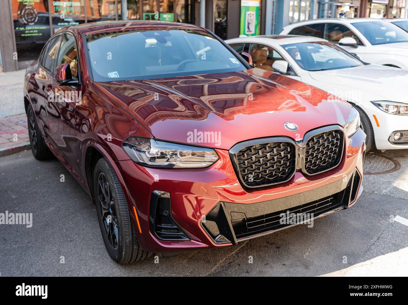 New York City, USA - March 31, 2024: BMW X4 orange car parked outdoor ...