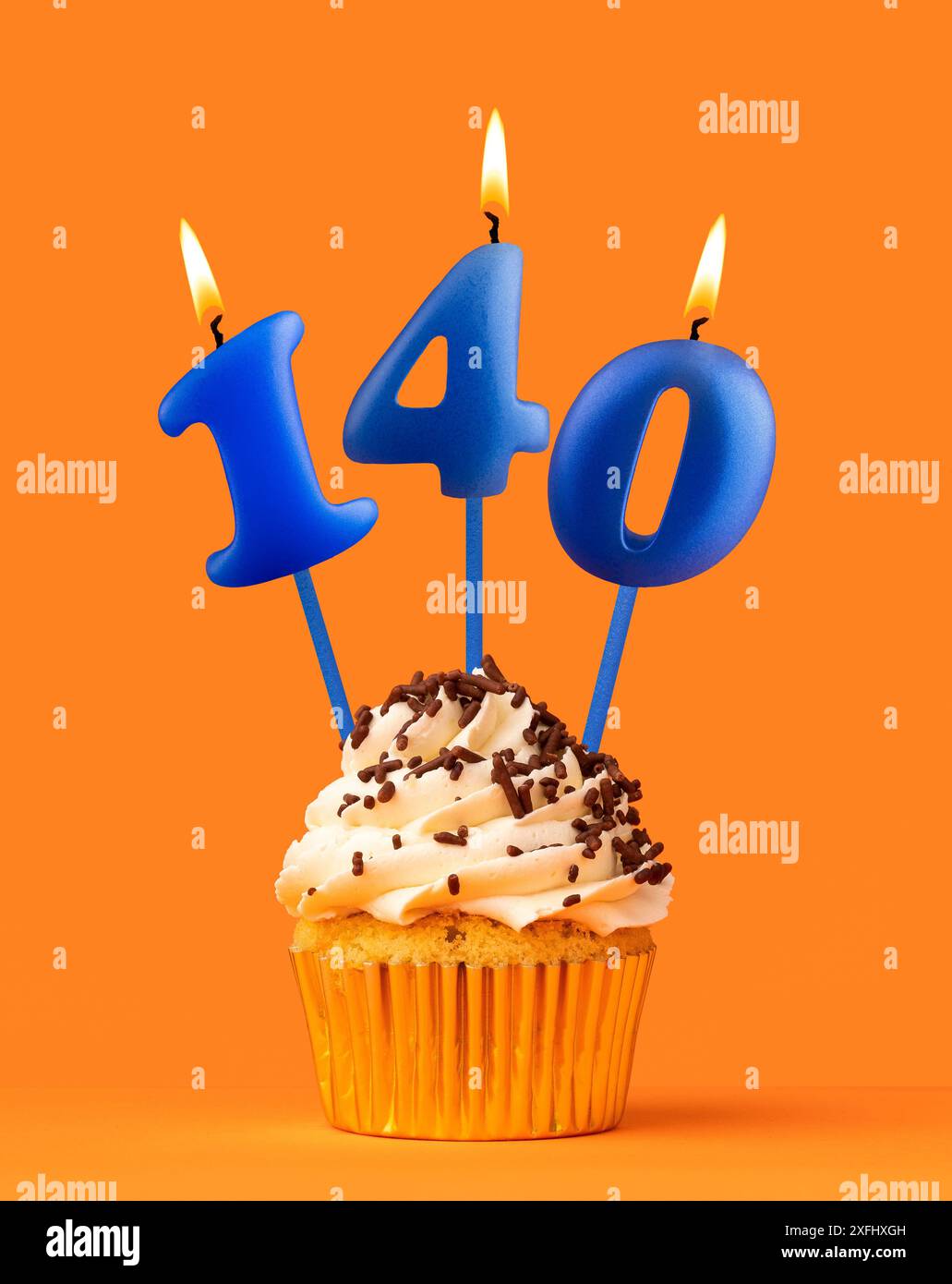 Blue birthday candle and cupcake - Number 140 Stock Photo - Alamy