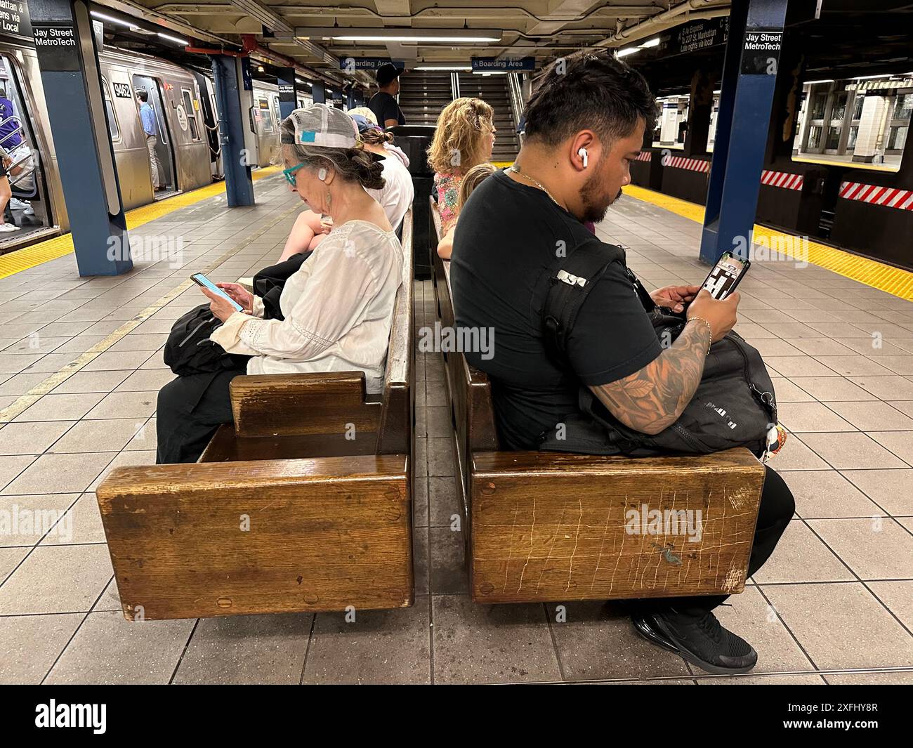 Subway riders waiting for their train at the Jay Street MetroTech ...