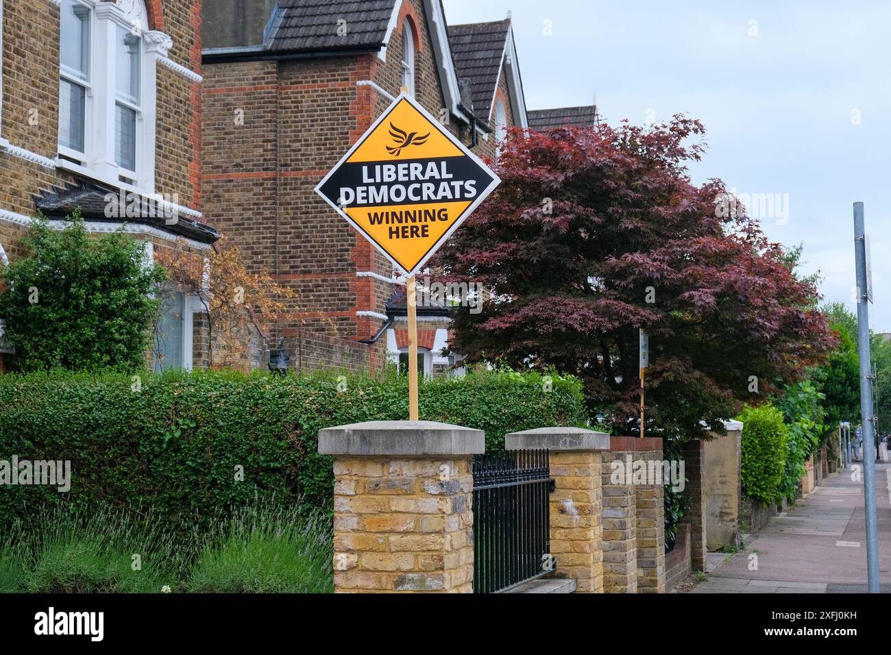 A Liberal Democrats diamond poster board outside a home in Wimbledon ...