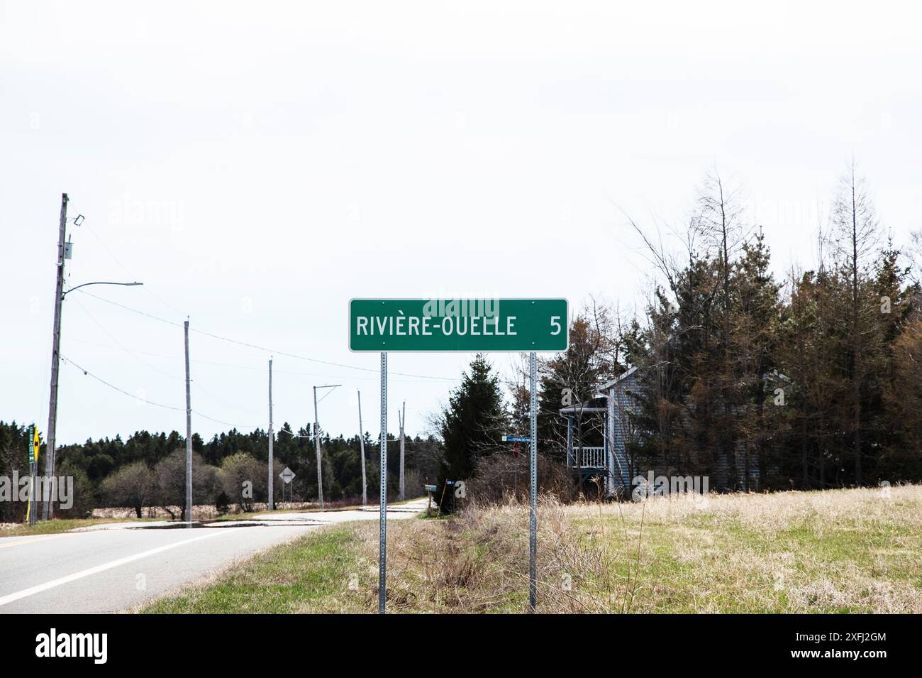 Highway distance sign on QC 132 in Rivière-Ouelle, Quebec, Canada Stock ...