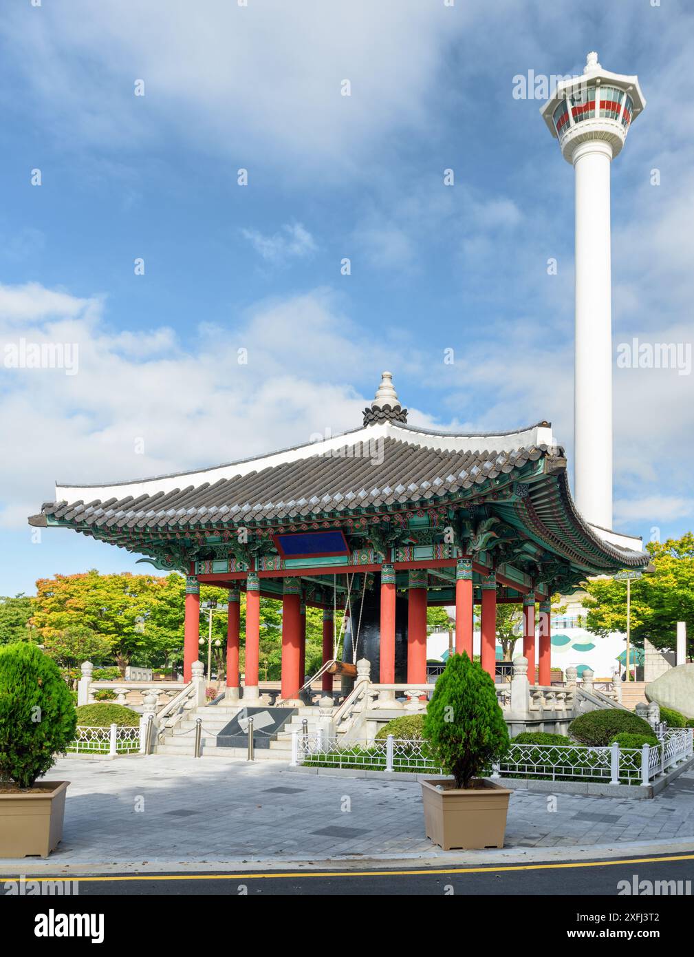 Wonderful view of Busan Tower on blue sky background and bell pavilion ...
