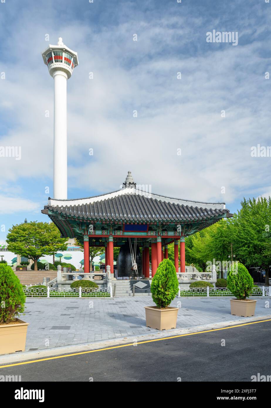 Wonderful view of Busan Tower on blue sky background and bell pavilion ...