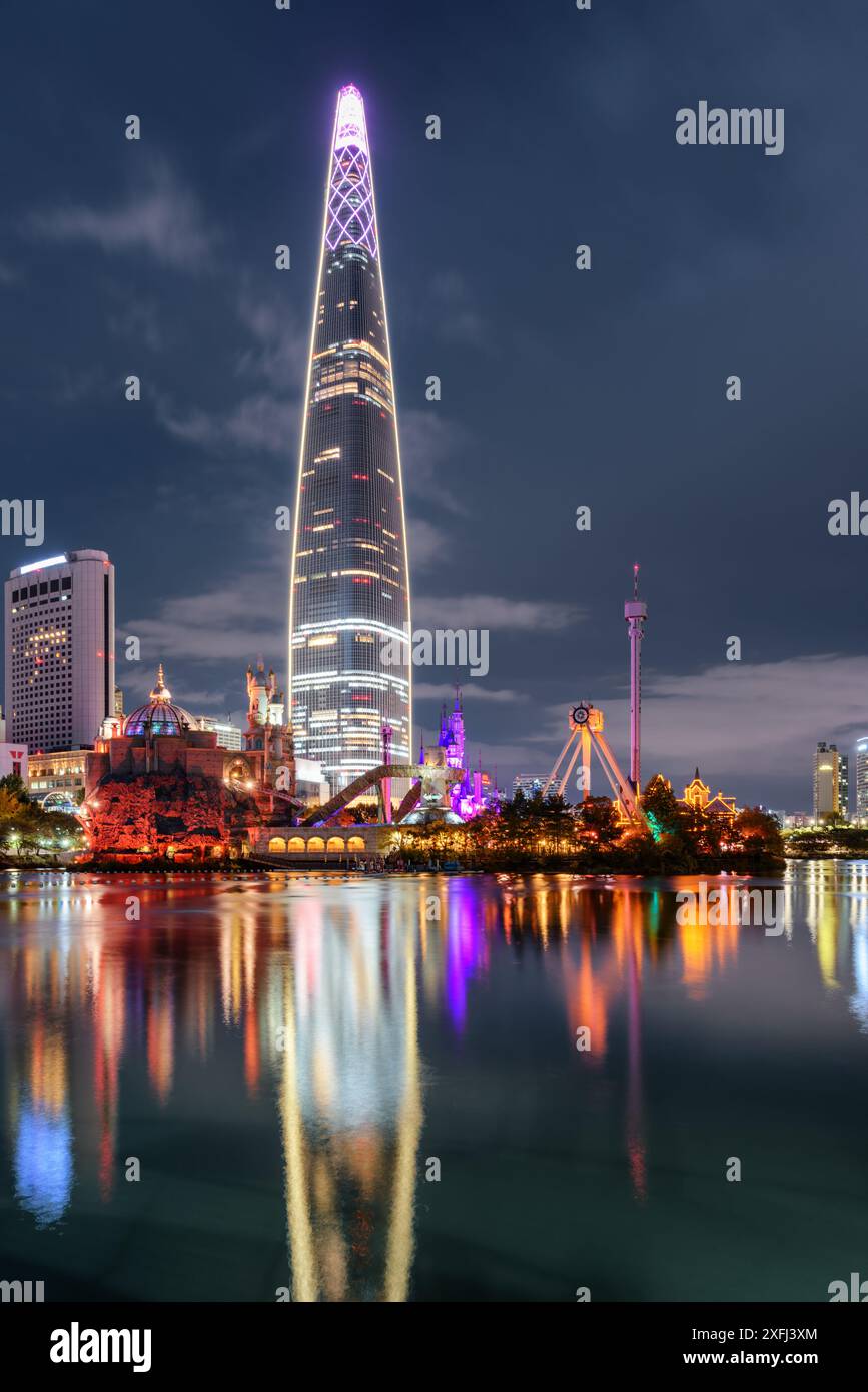 Beautiful night view of skyscraper and other modern buildings reflected ...