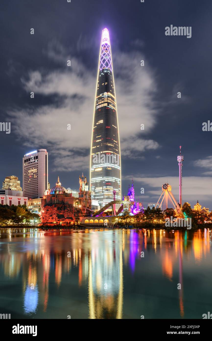 Beautiful night view of skyscraper and other modern buildings reflected ...