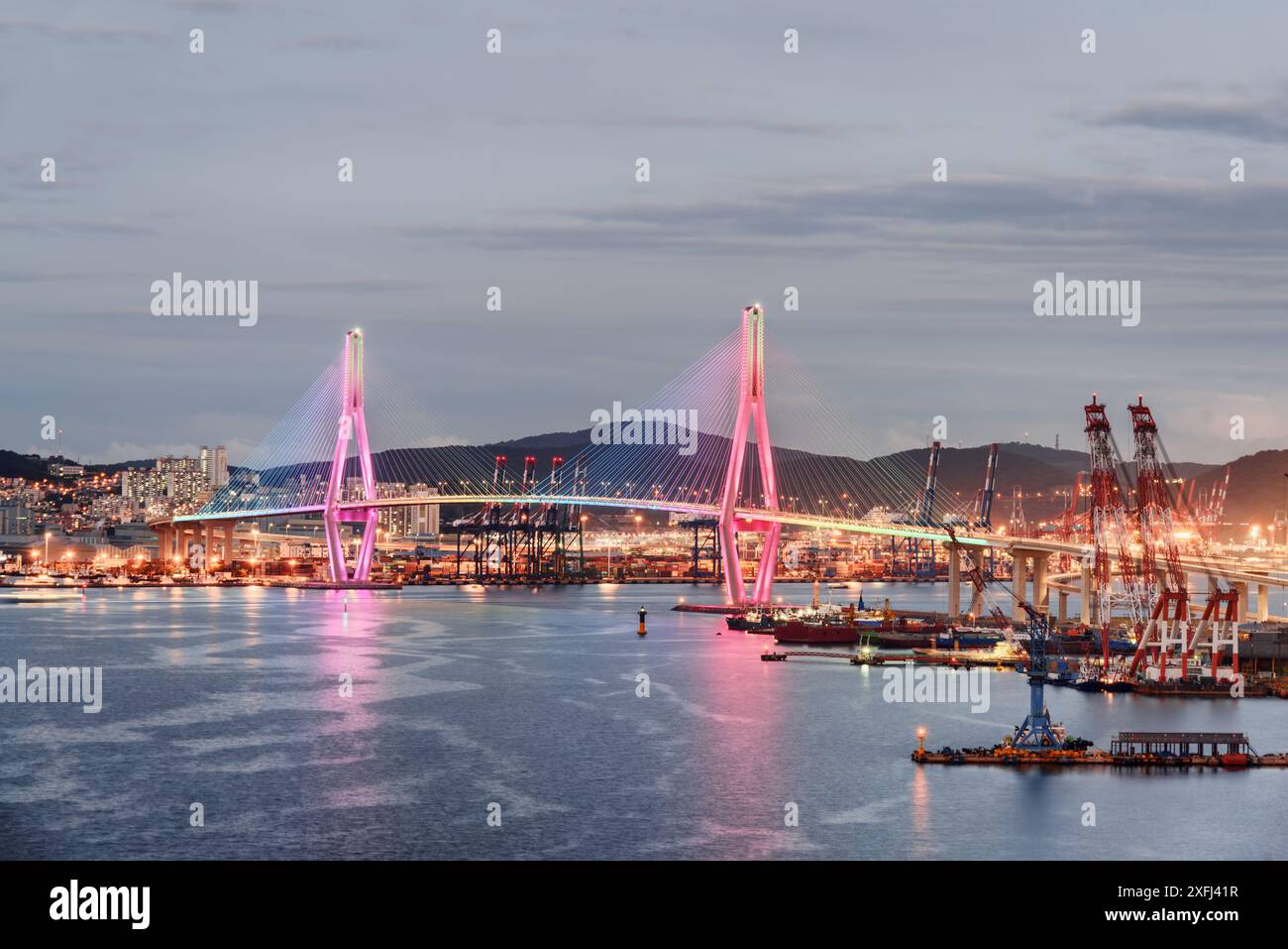 Colorful evening view of Busan Harbor Bridge and the Port of Busan in ...
