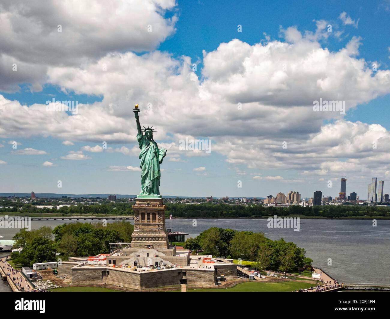 The Statue of Liberty over the Panorama of New York cityscape. New York ...