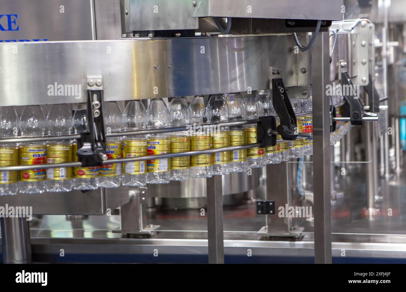 Bangkok, Thailand - June 15, 2024: Automatic foods liquid filling ...