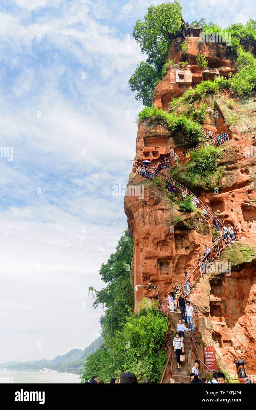 Leshan, China - September 28, 2017: Tourists going down stairs to the ...