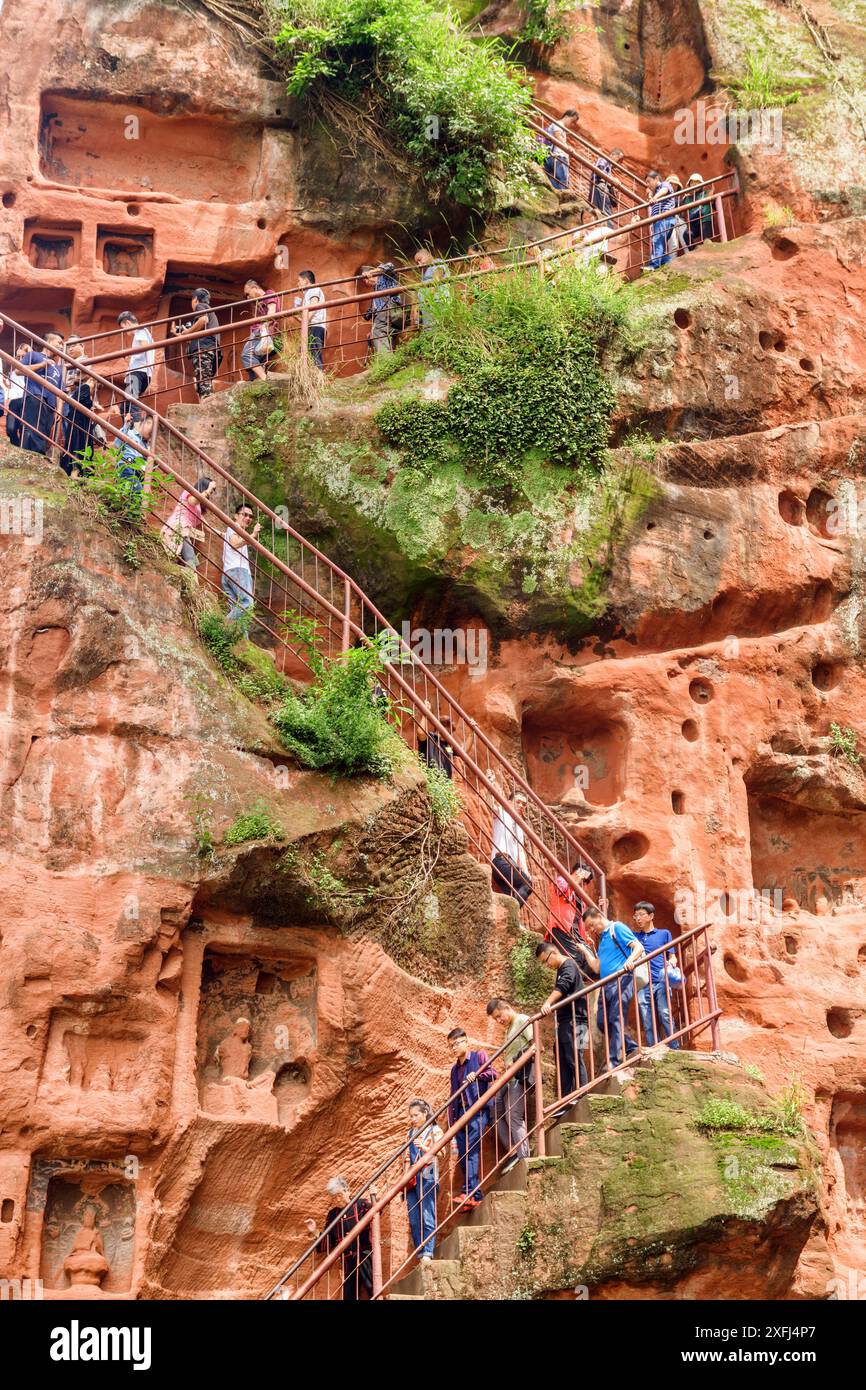 Leshan, China - September 28, 2017: Tourists going down stairs to the ...
