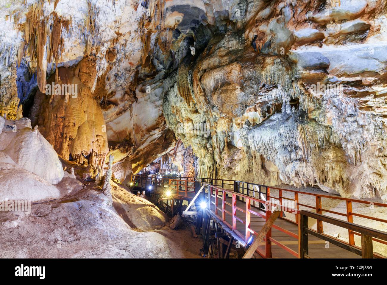 Wooden walkway through natural underground corridor inside Paradise ...