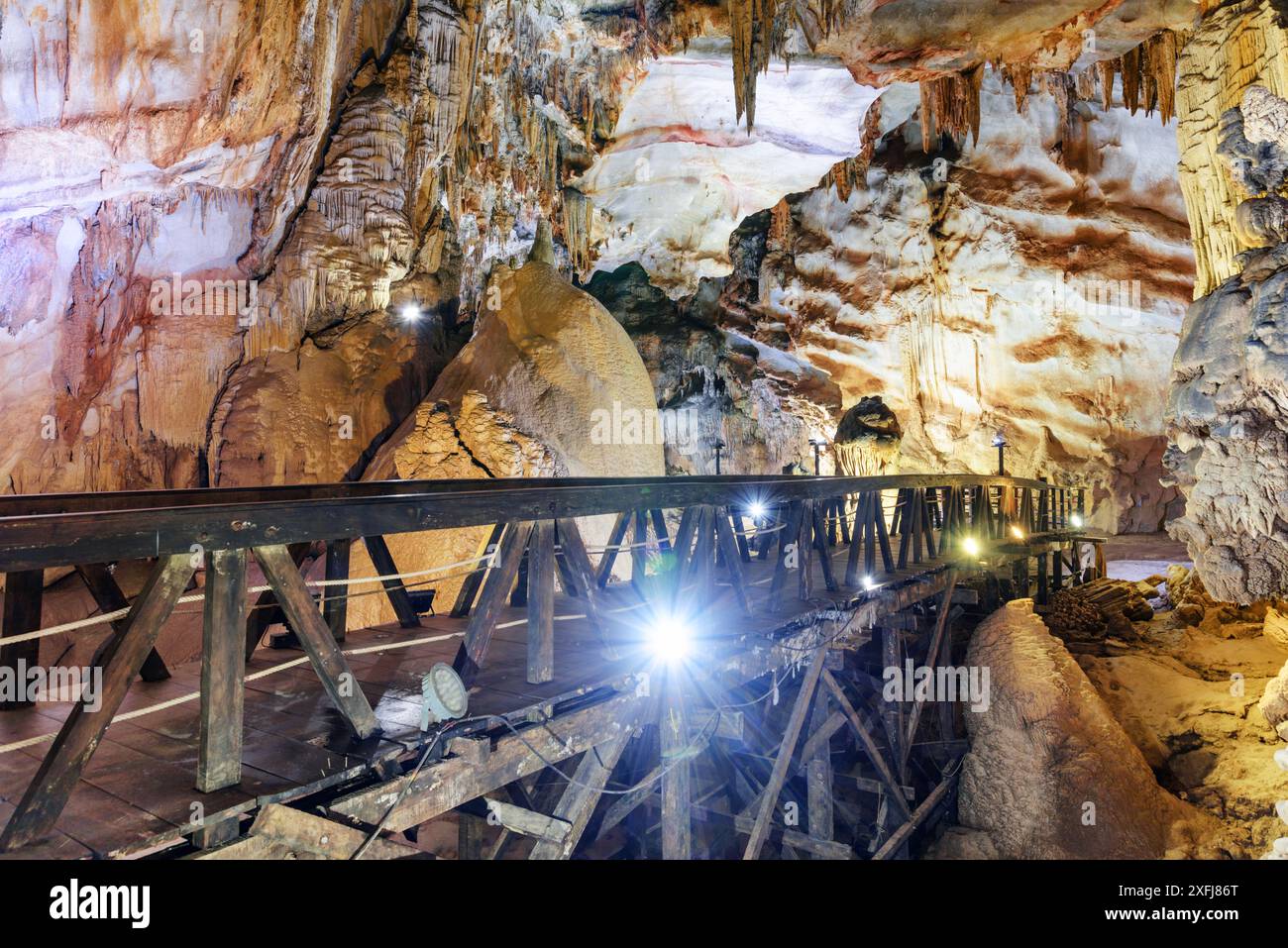 Wooden walkway through natural underground corridor inside Paradise ...