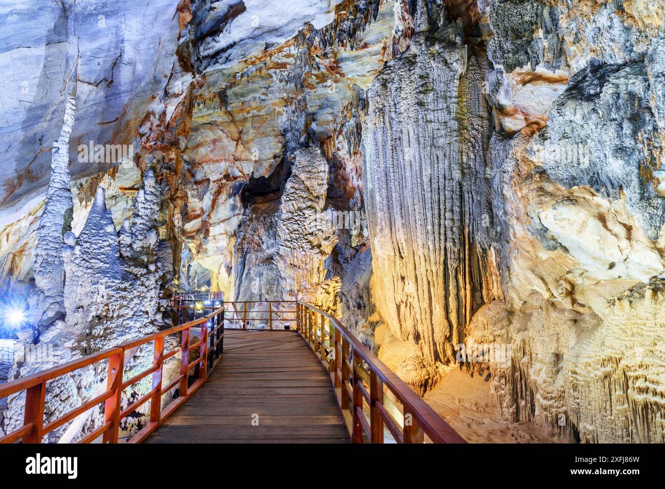 Wooden walkway through natural underground corridor inside Paradise ...