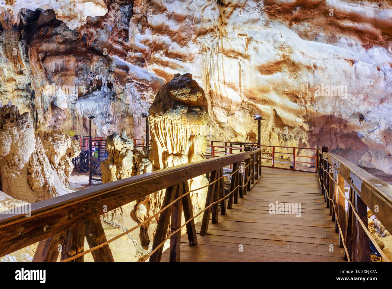 Wooden walkway through natural underground corridor inside Paradise ...