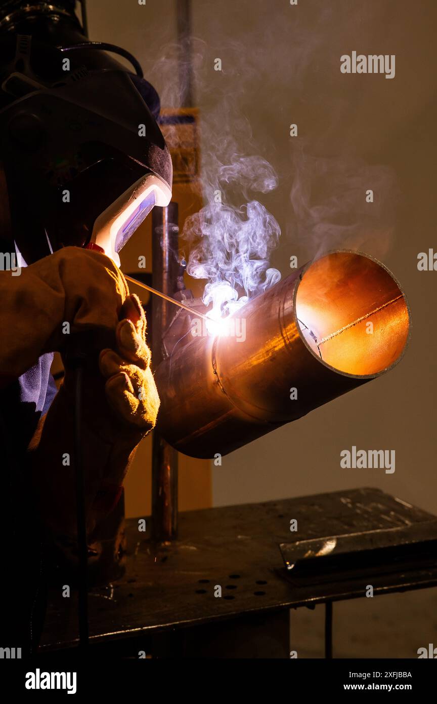 Professional welder welds metal pipe hi-res stock photography and ...