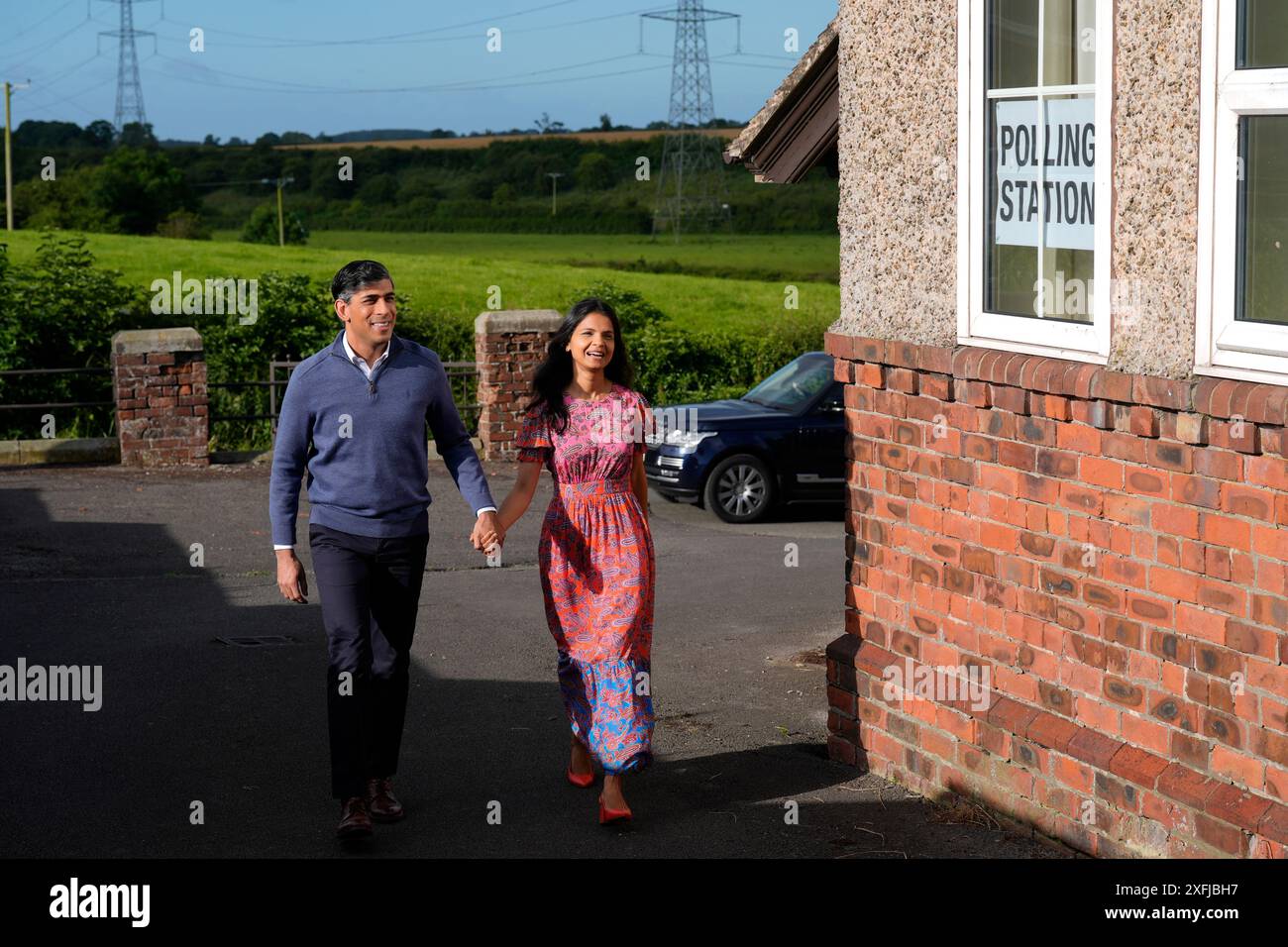 Prime Minister Rishi Sunak and his wife Akshata Murty arrive to cast their vote in the 2024 ...