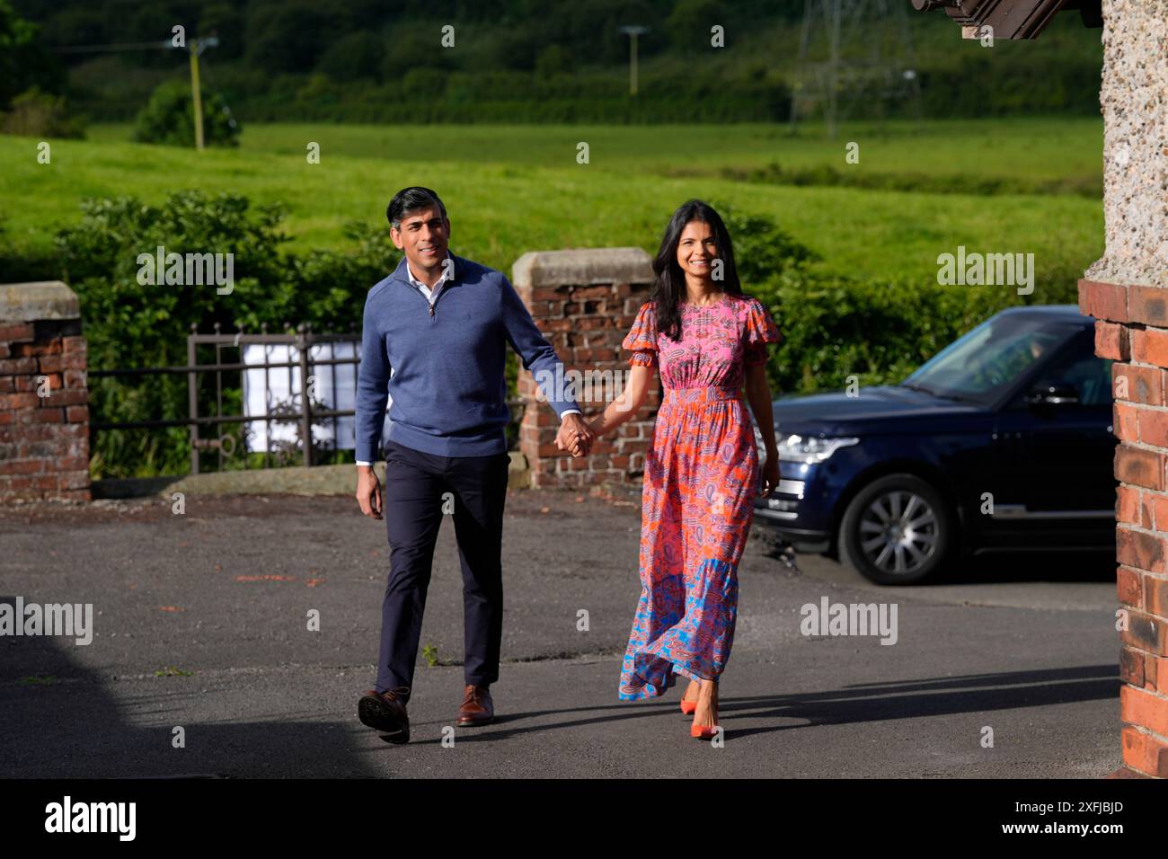 Prime Minister Rishi Sunak and his wife Akshata Murty arrive to cast their vote in the 2024 ...