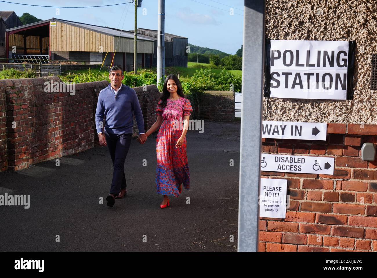 Prime Minister Rishi Sunak and his wife, Akshata Murty, arrive to cast their vote in the 2024 ...