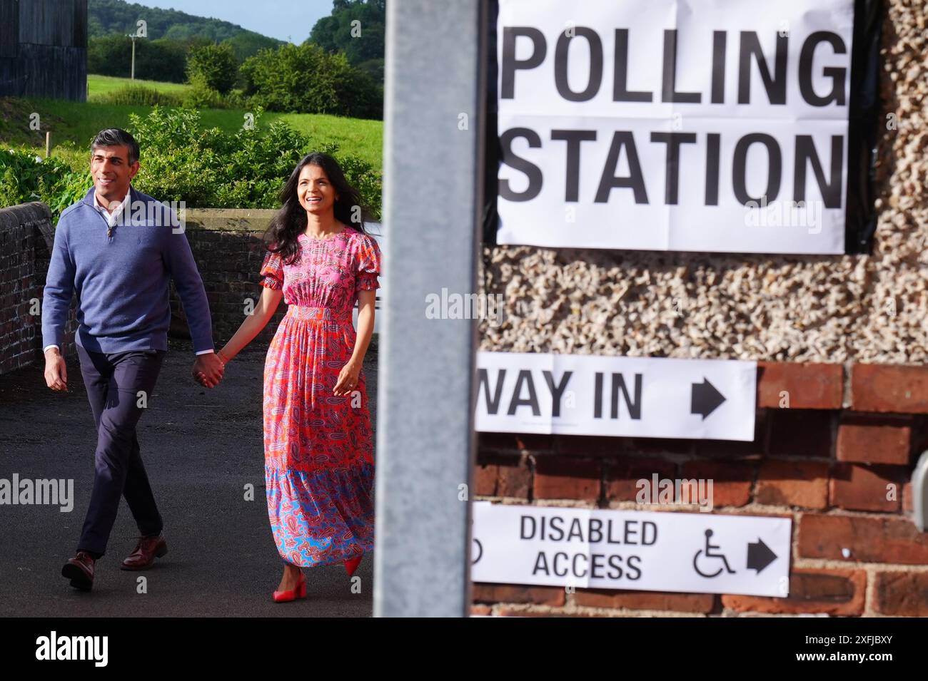 Prime Minister Rishi Sunak and his wife, Akshata Murty, arrive to cast their vote in the 2024 ...